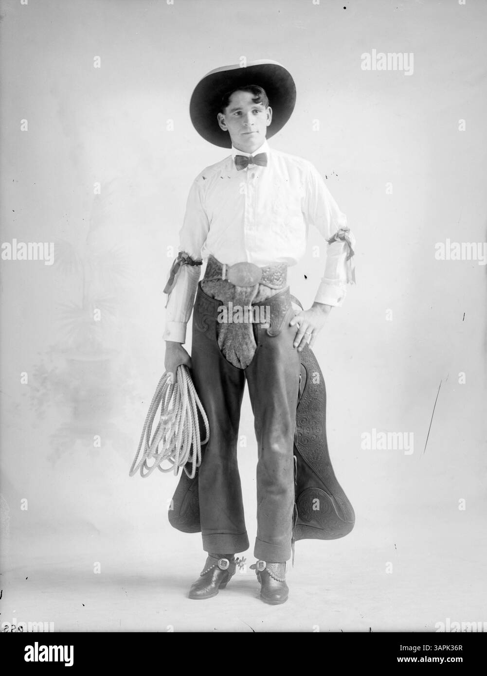 A black and white studio portrait of Enos Yakima E. Canutt, a cowboy in ...