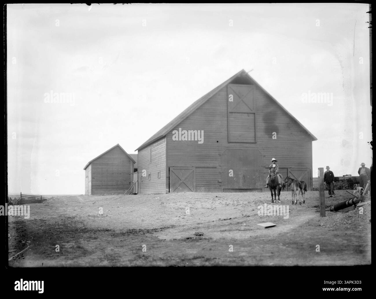 This photograph by Lee Moorhouse features barns at the J. Crowe ranch ...