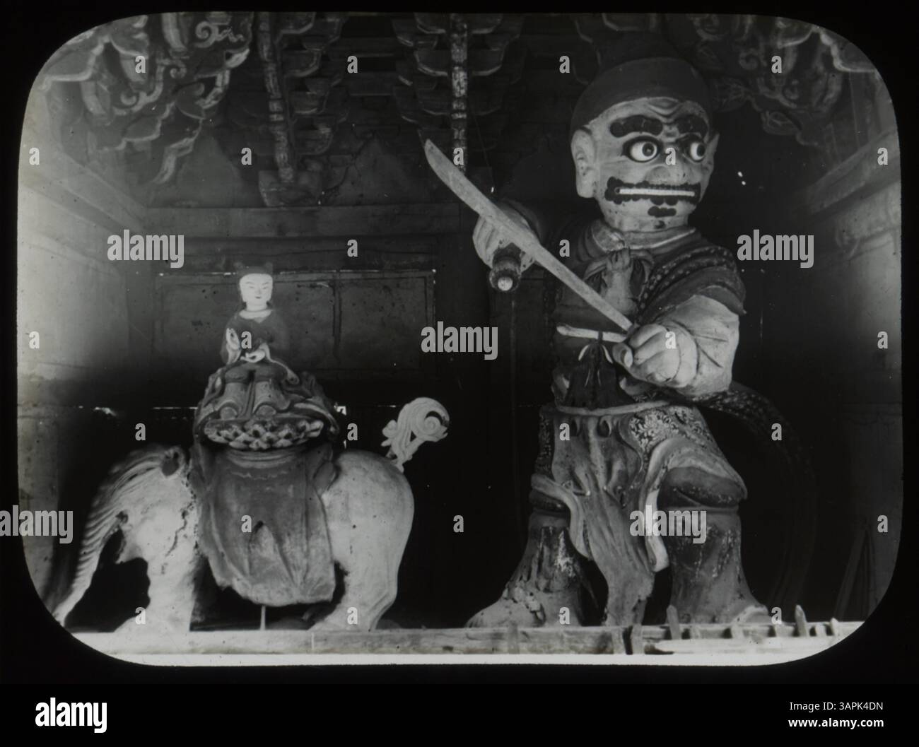 This 1917 photograph captures one of the Four Deva Kings at Songkwang ...