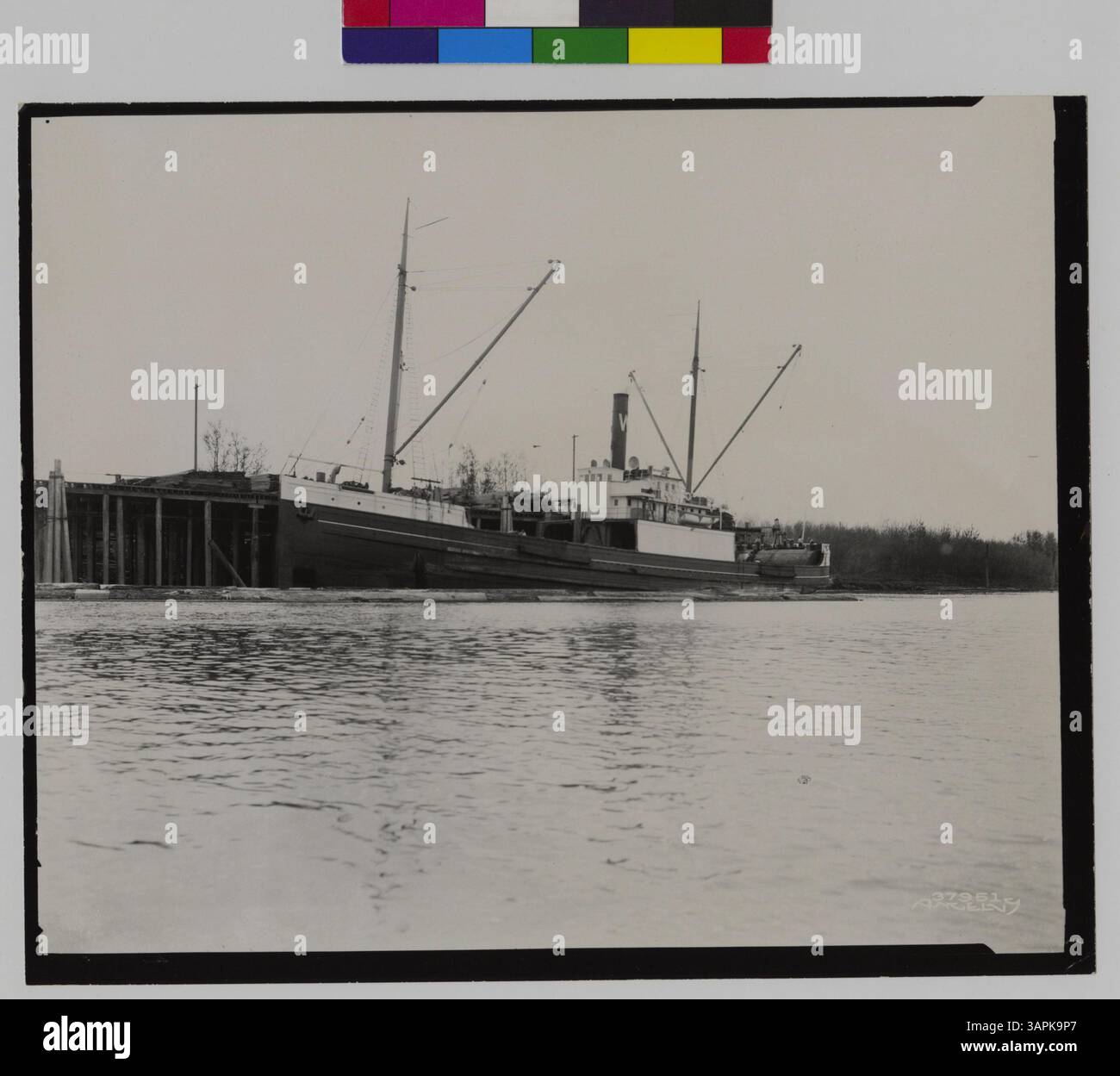 A photograph of a freighter docked at a port, attributed to the North ...
