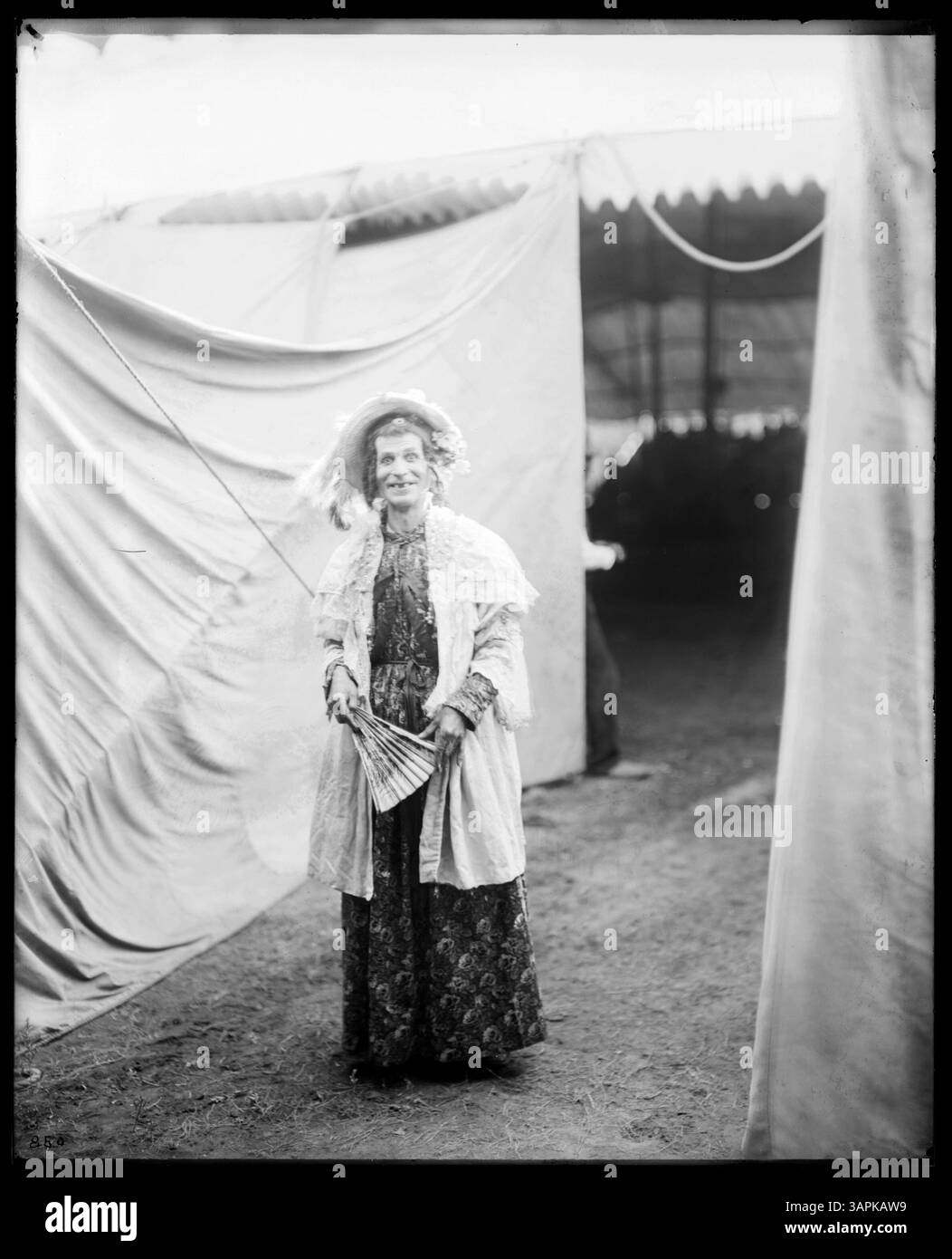 A photograph of a clown dressed as a woman from the Sells-Gray Circus ...