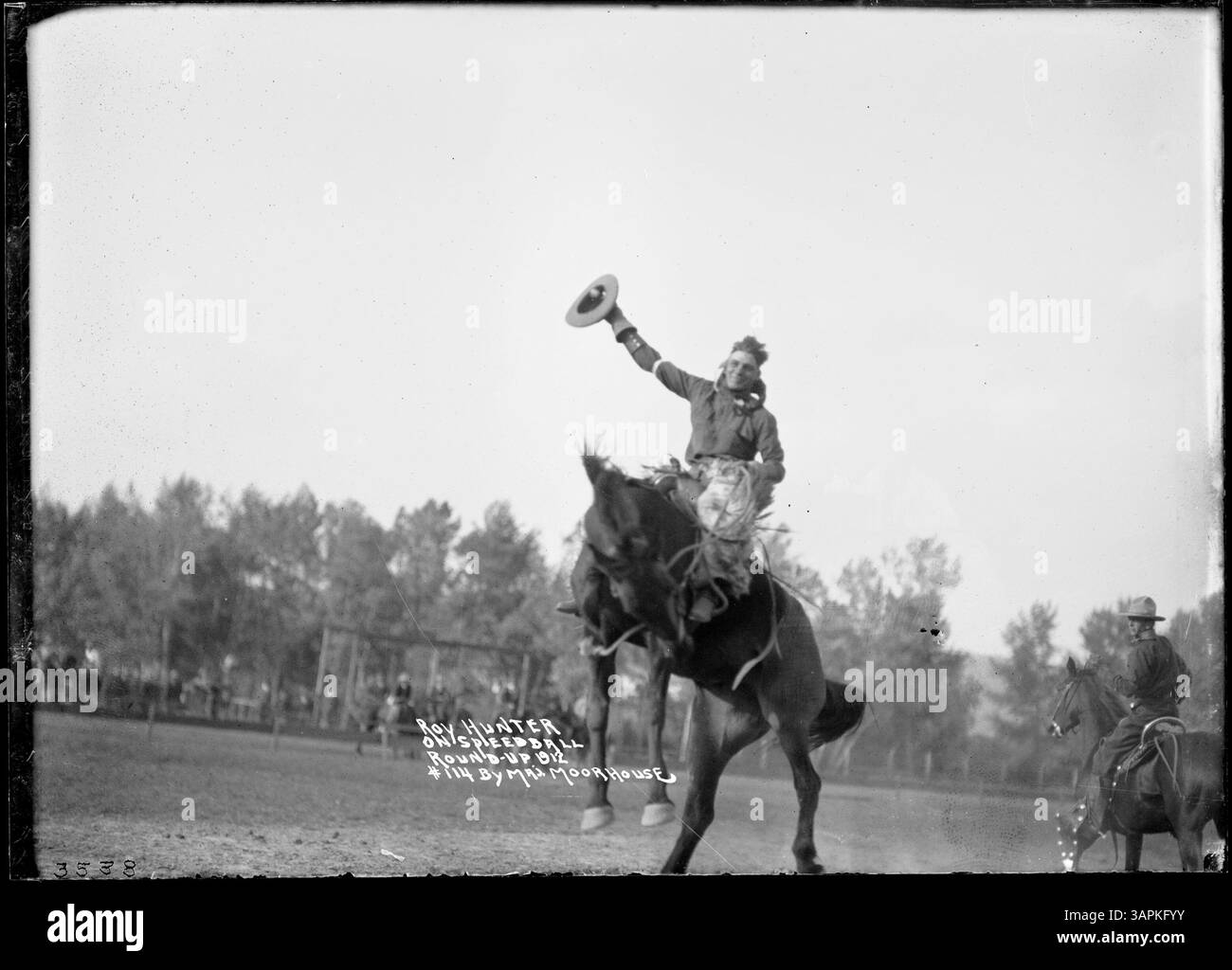 A photograph by Lee Moorhouse showing Roy Hunter riding a bucking horse ...