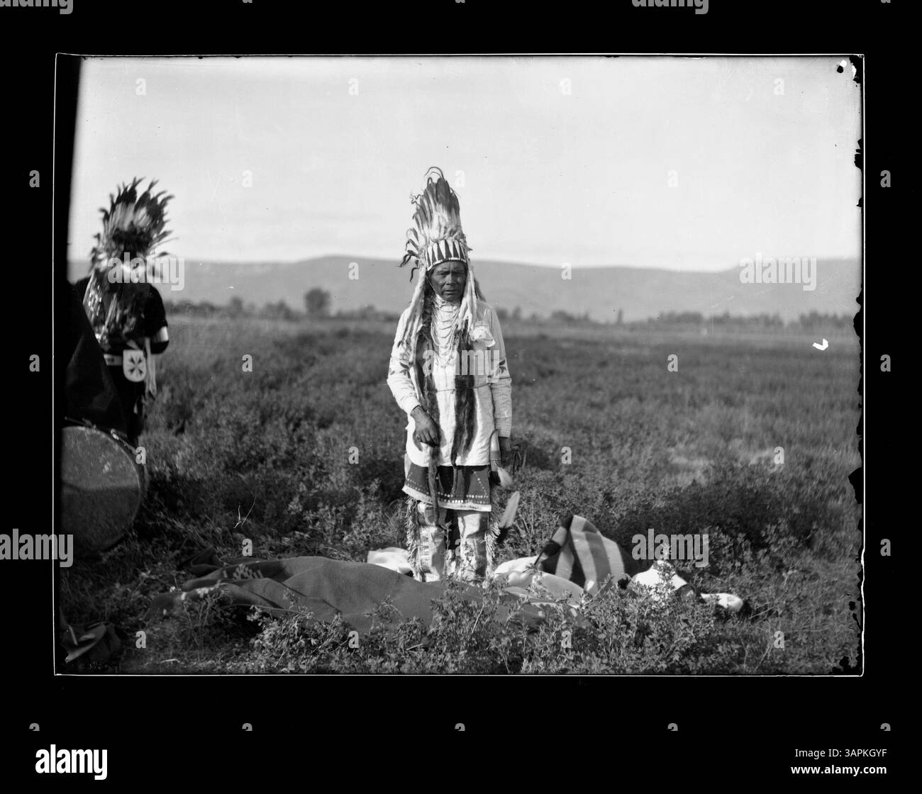 The photograph features a Yakima Indian singer dressed in traditional ...