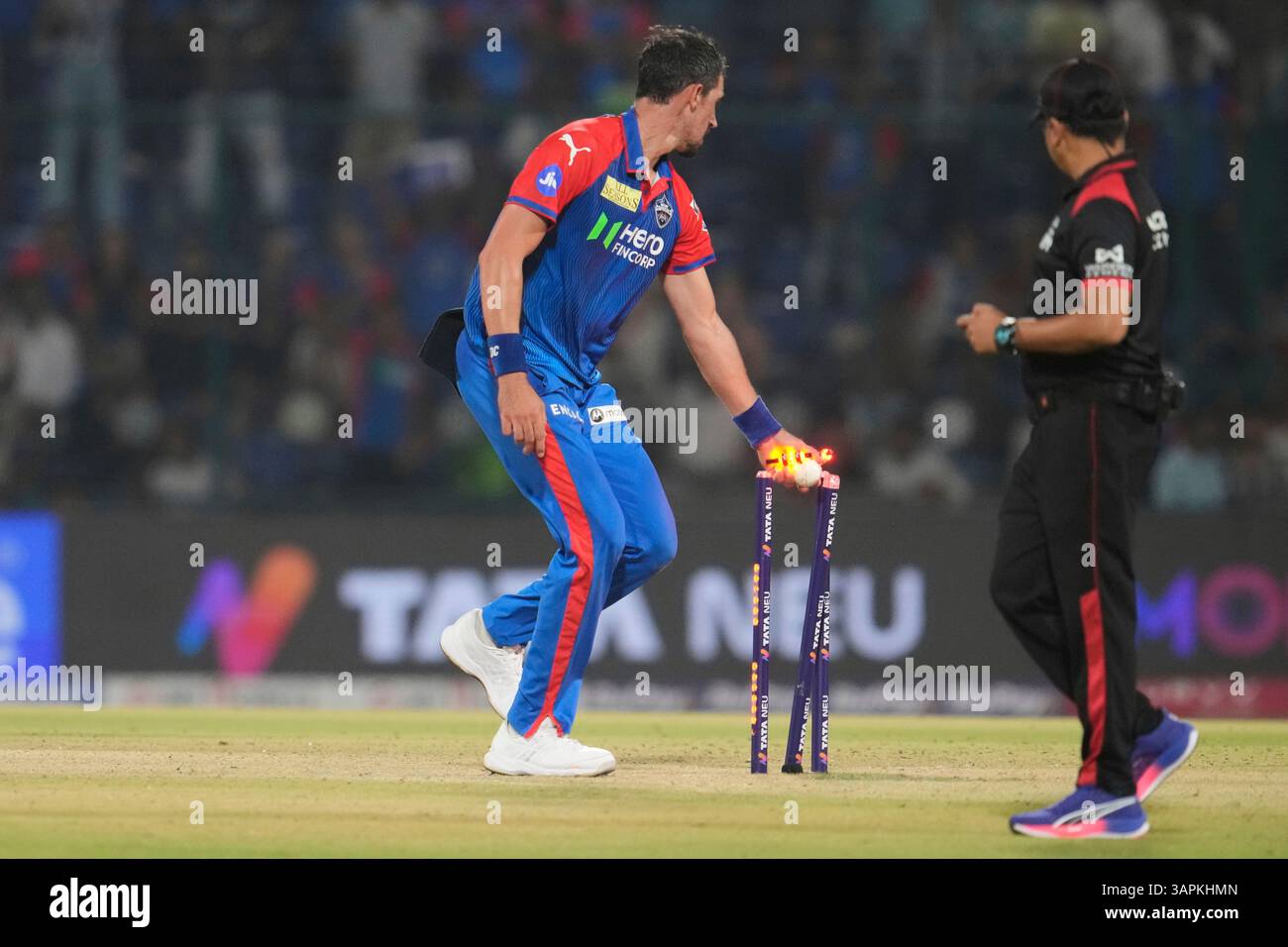 Delhi Capitals' Mitchell Starc breaks the stumps to run-out Rajasthan ...