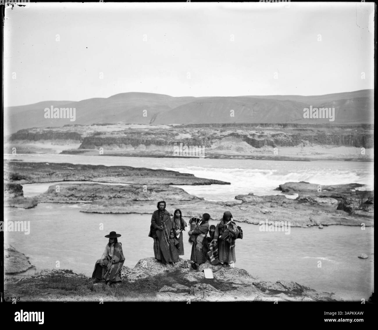 This photograph by Lee Moorhouse depicts a tribal family at Celilo ...
