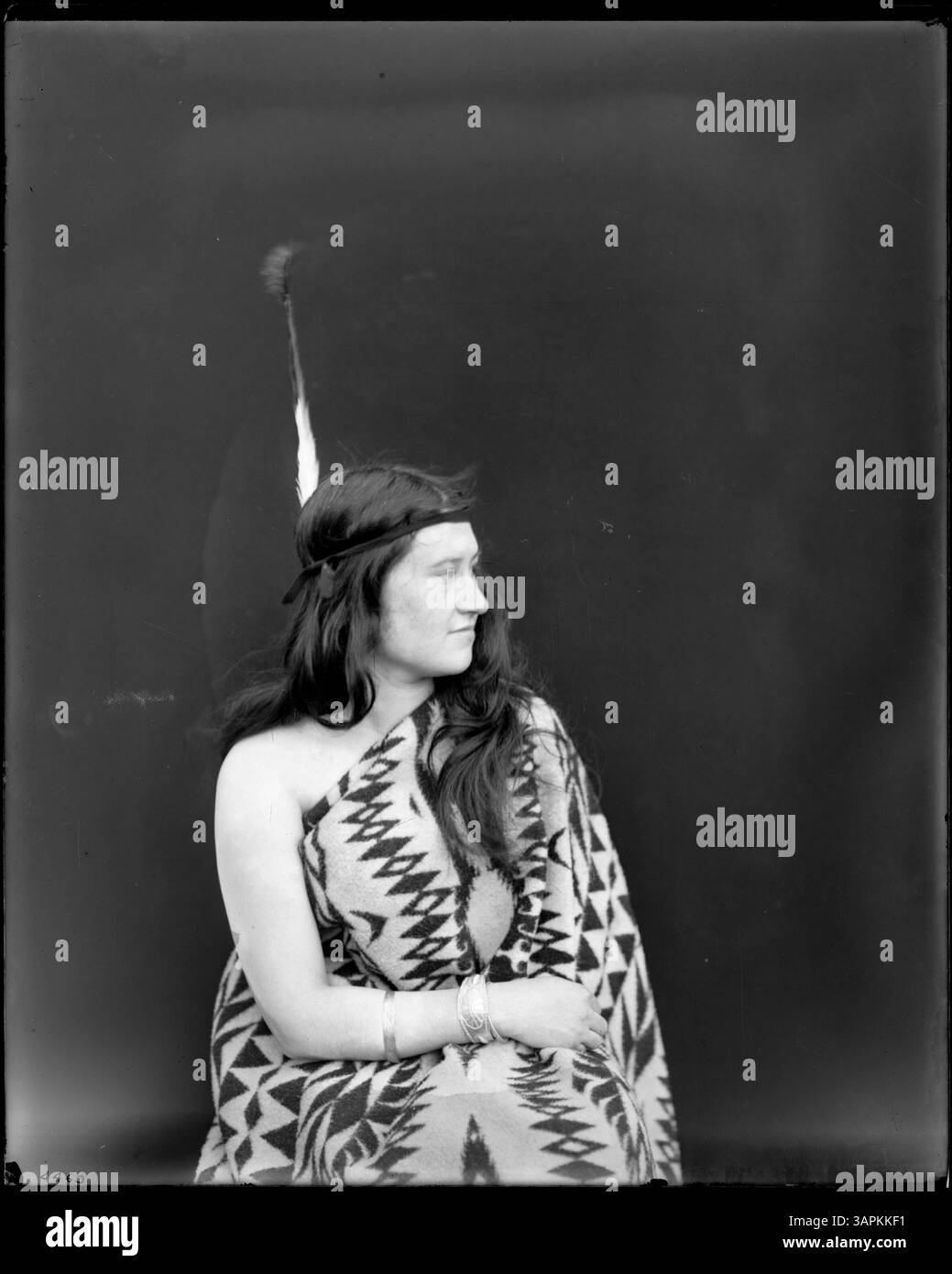 The image features Esther Umahollis, an Umpqua tribal woman, wearing ...