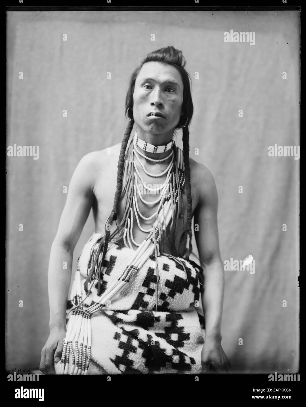 This photograph features Yee-Yee, a Umatilla Indian, dressed in ...