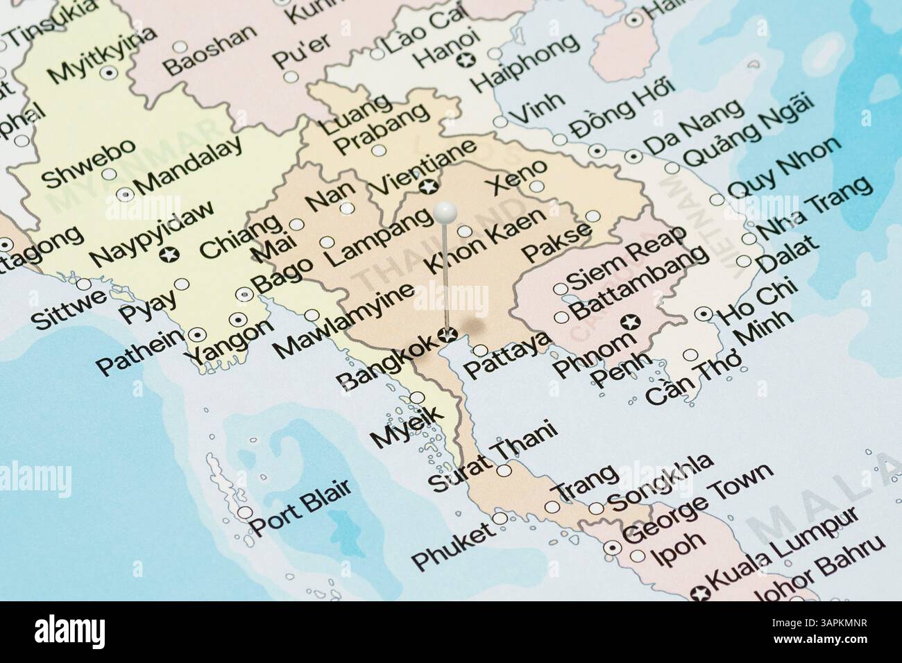 macro photo of a white pin needle into Bangkok city of Thailand ...