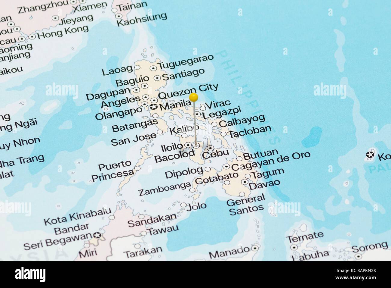 macro photo of a yellow pin needle into Bacolod city of Philippines political map Stock Photo ...