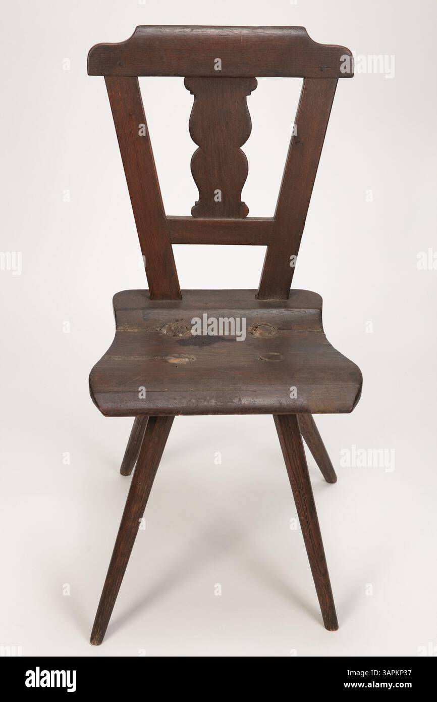 This German Alpine style side chair, made of walnut, features a peg and ...