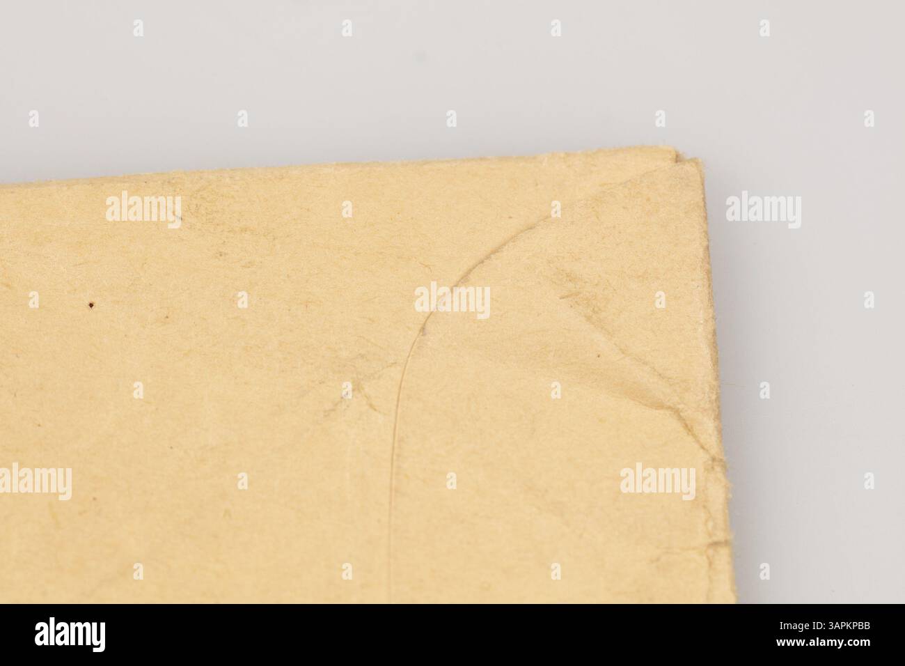 A brown wool textile from John H. MacCarthy Tailoring Company, packed ...