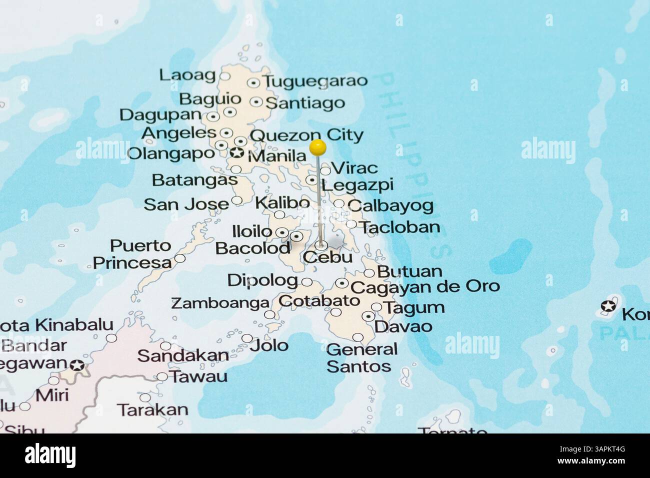 macro photo of a yellow pin needle into Cebu city of Philippines ...