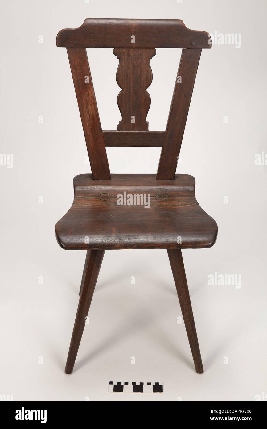 This German Alpine style side chair, crafted from walnut, features peg ...