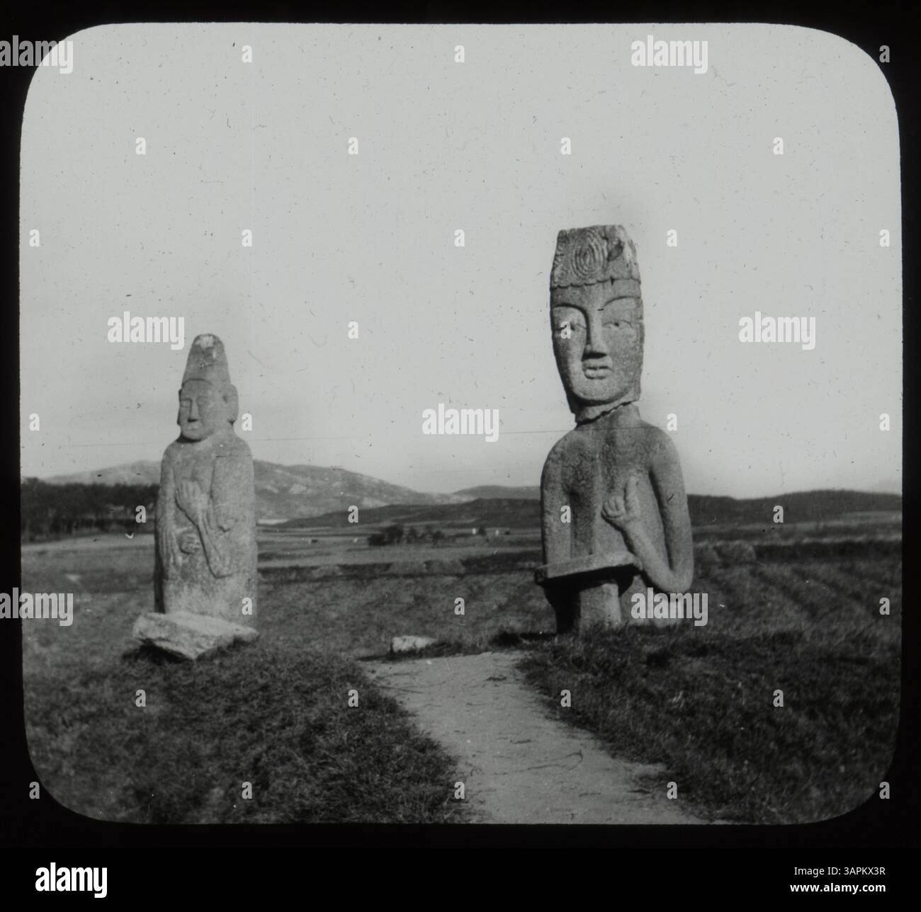 A 1913 photograph of two Buddha figures in Ansung, Korea, captured by ...