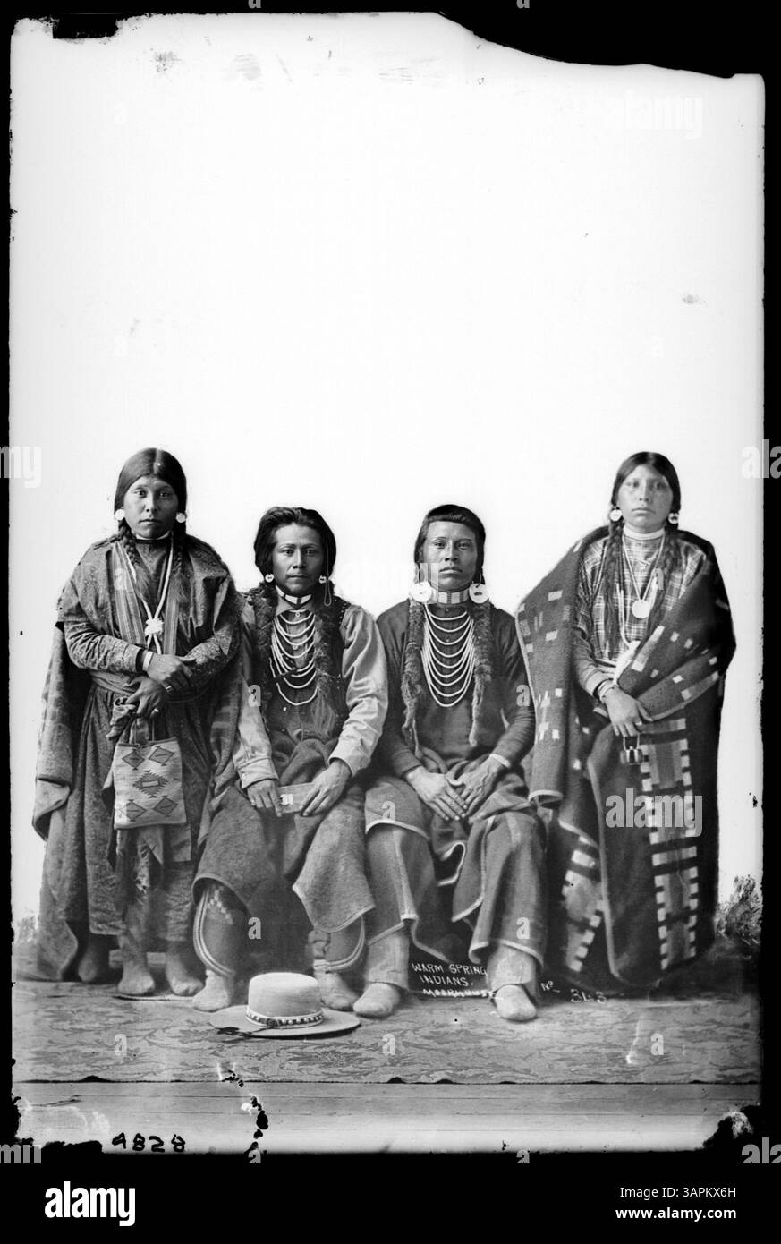 This photograph shows Warm Springs Indian men in traditional regalia ...