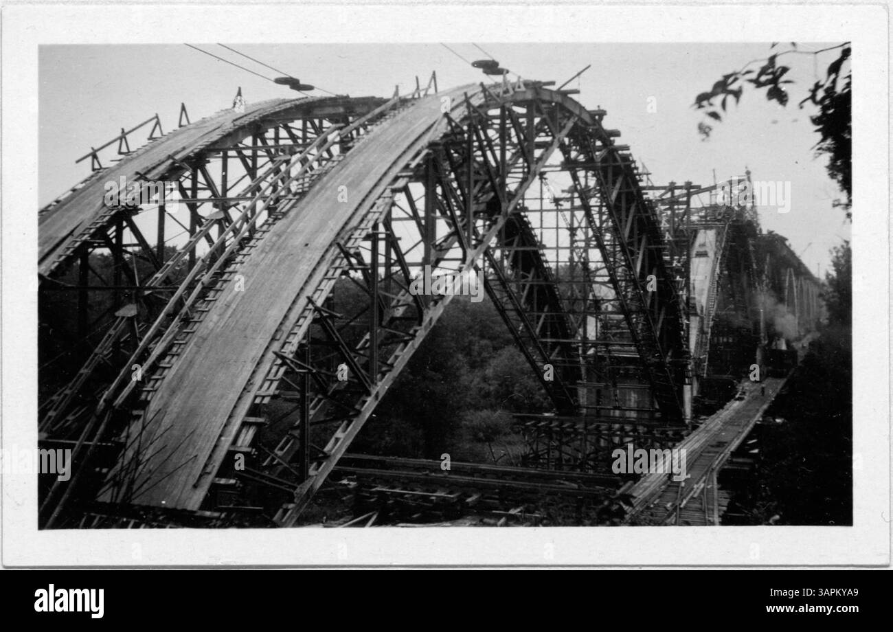 The Mendota Bridge, under construction, shows a metal framework with a ...
