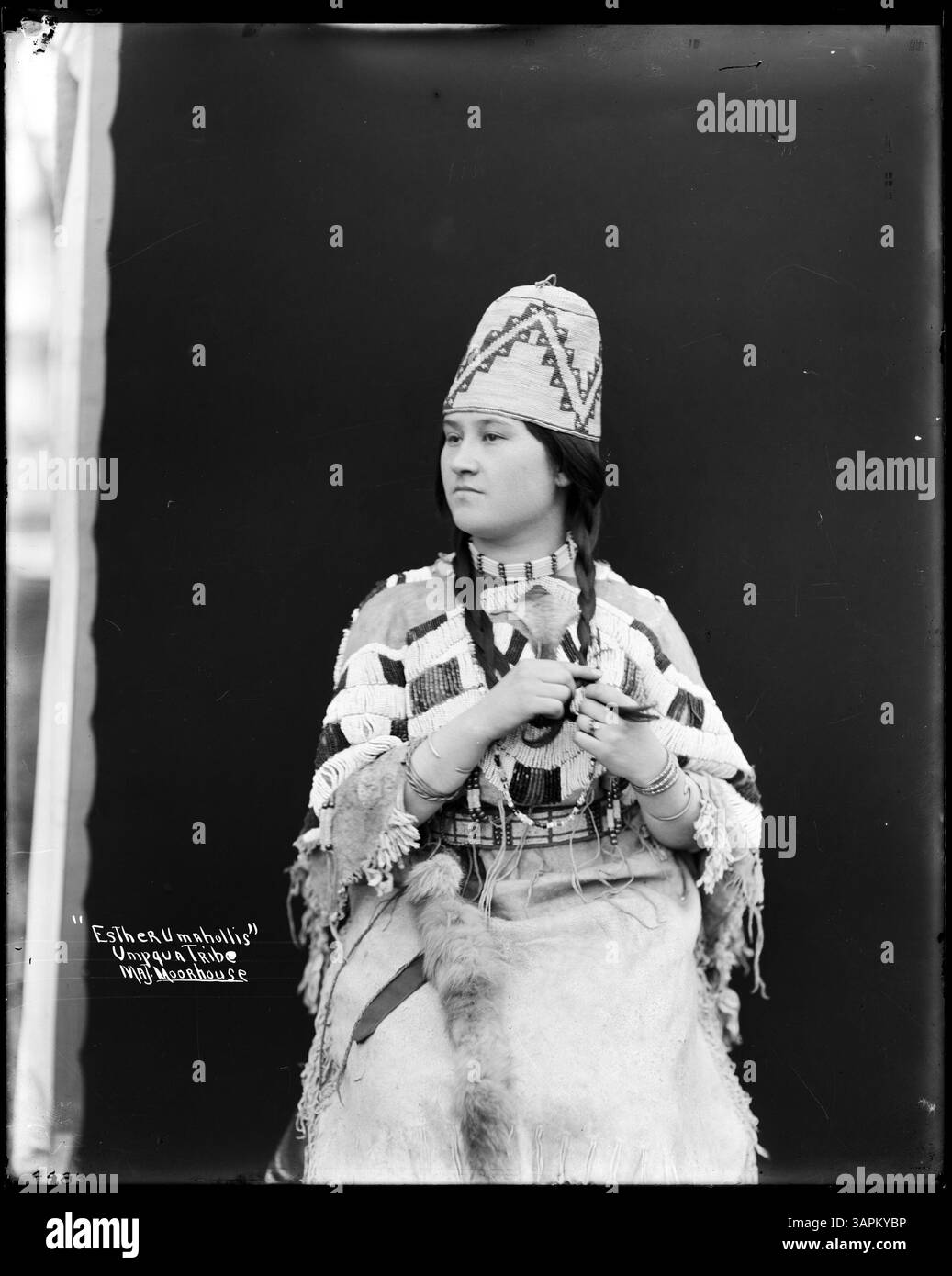 Photograph of Esther Umahollis, an Umpqua tribal woman, wearing various ...