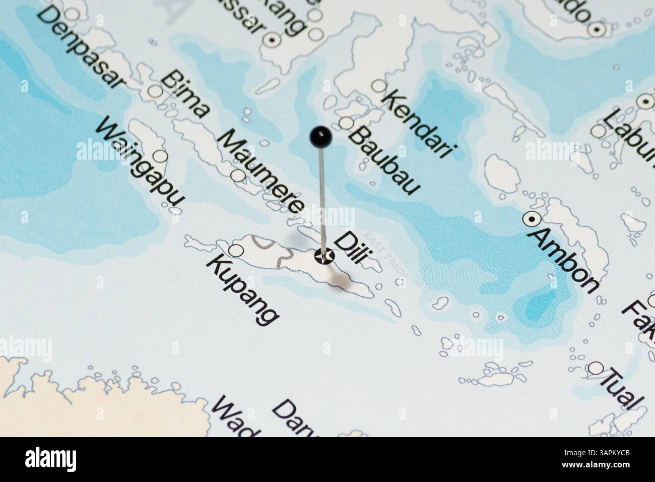 macro photo of a black pin needle into dili city of east timor ...