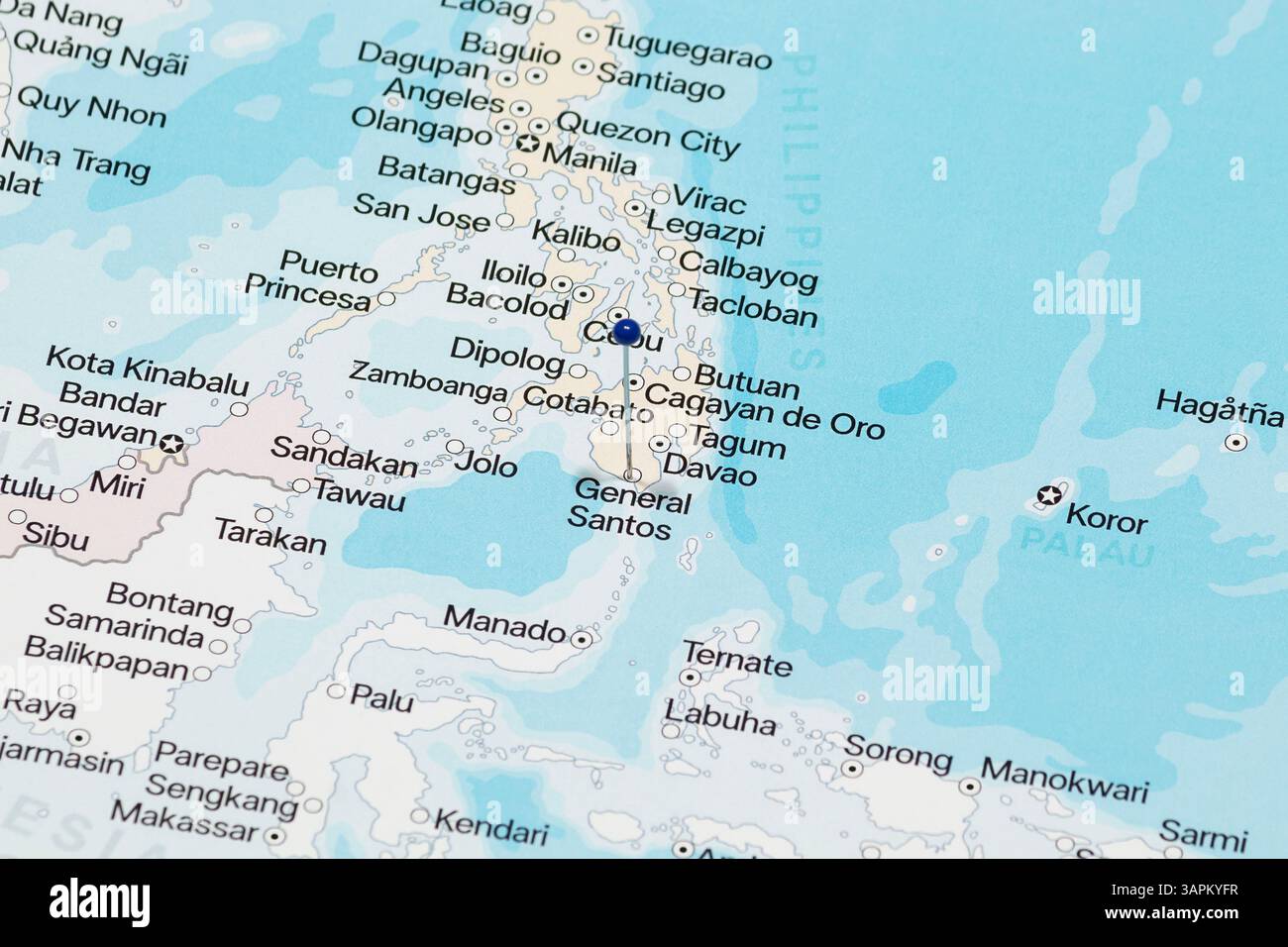 macro photo of a blue pin needle into general santos city of ...