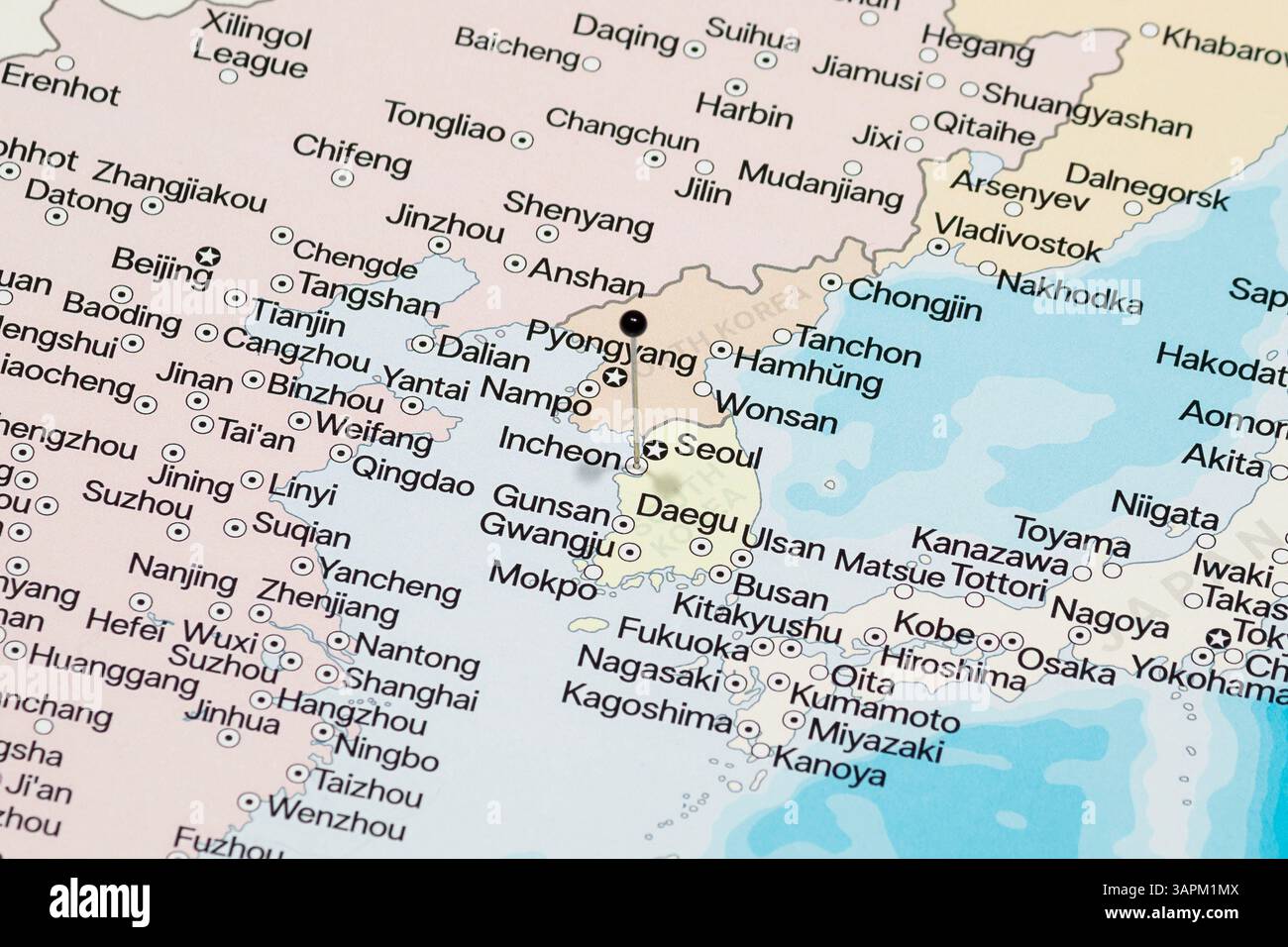 macro photo of a black pin needle into Incheon city of South Korea ...