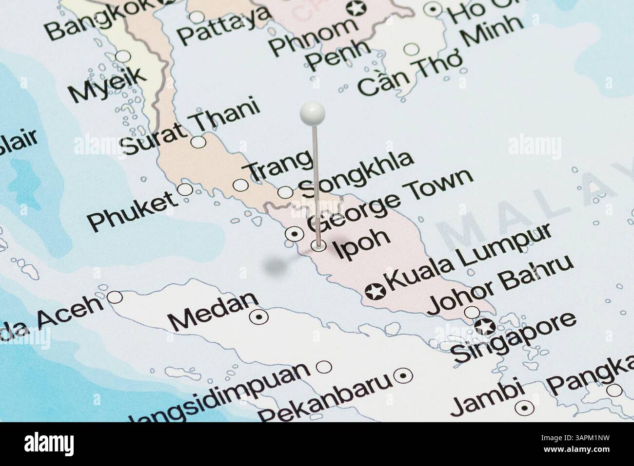 macro photo of a white pin needle into ipoh city of malaysia political ...