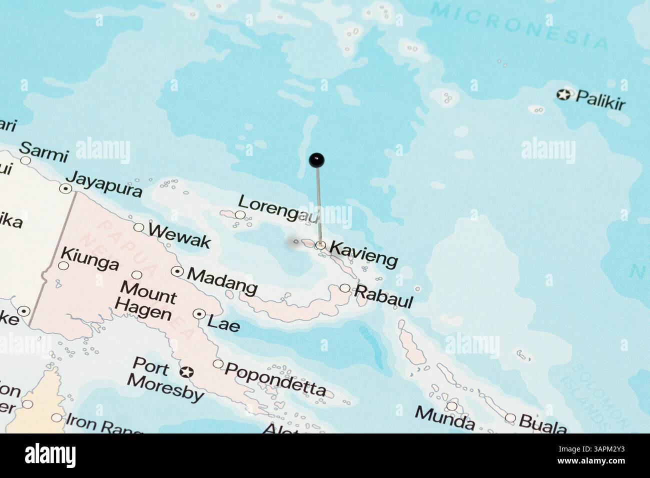 macro photo of a black pin needle into Kavieng city of Papua New Guinea ...