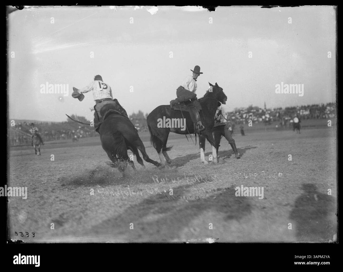 Lee Moorhouse photograph of Rufus Rollen riding a bucking horse named ...