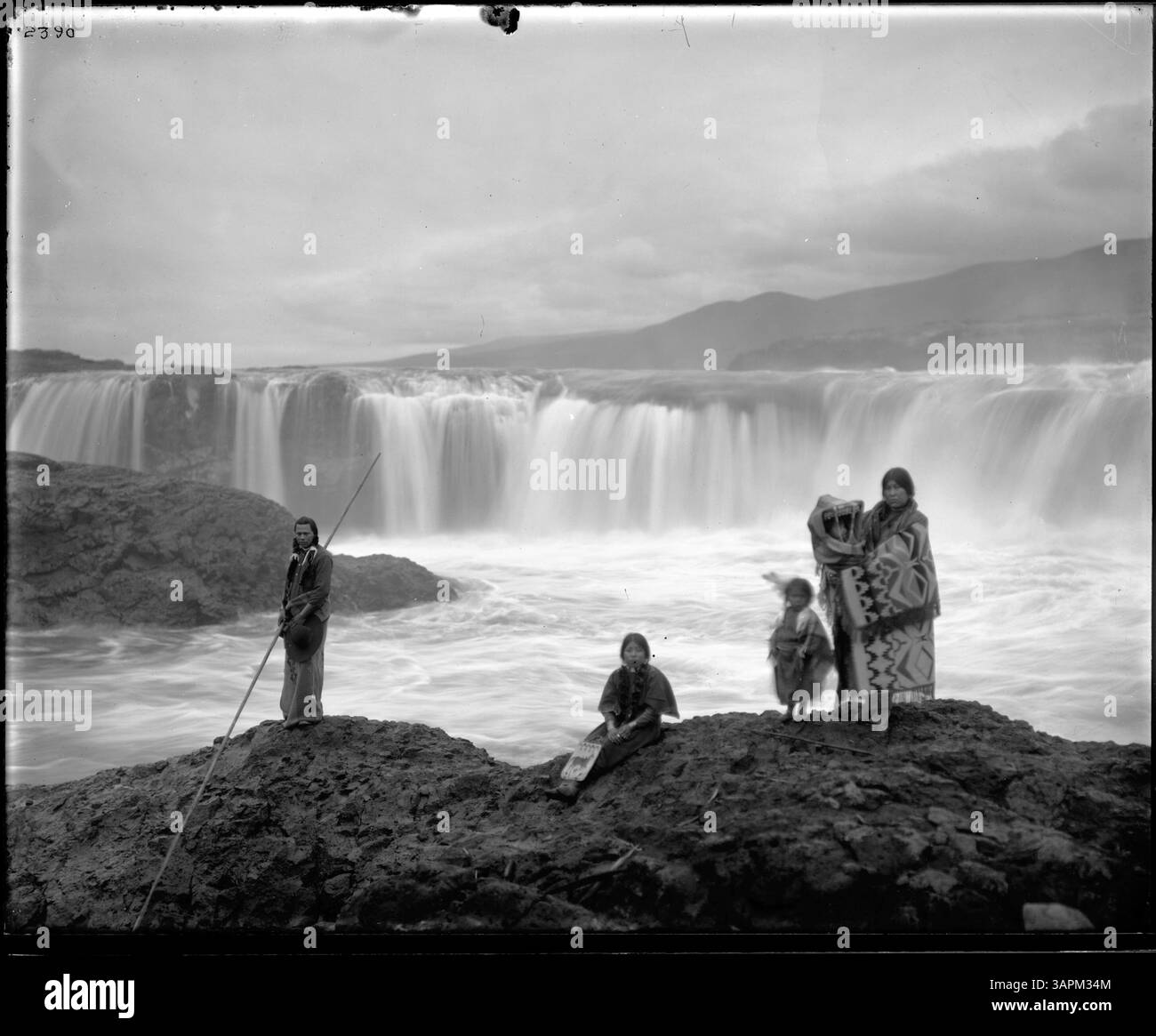 This photograph by Lee Moorhouse shows a tribal family fishing at ...