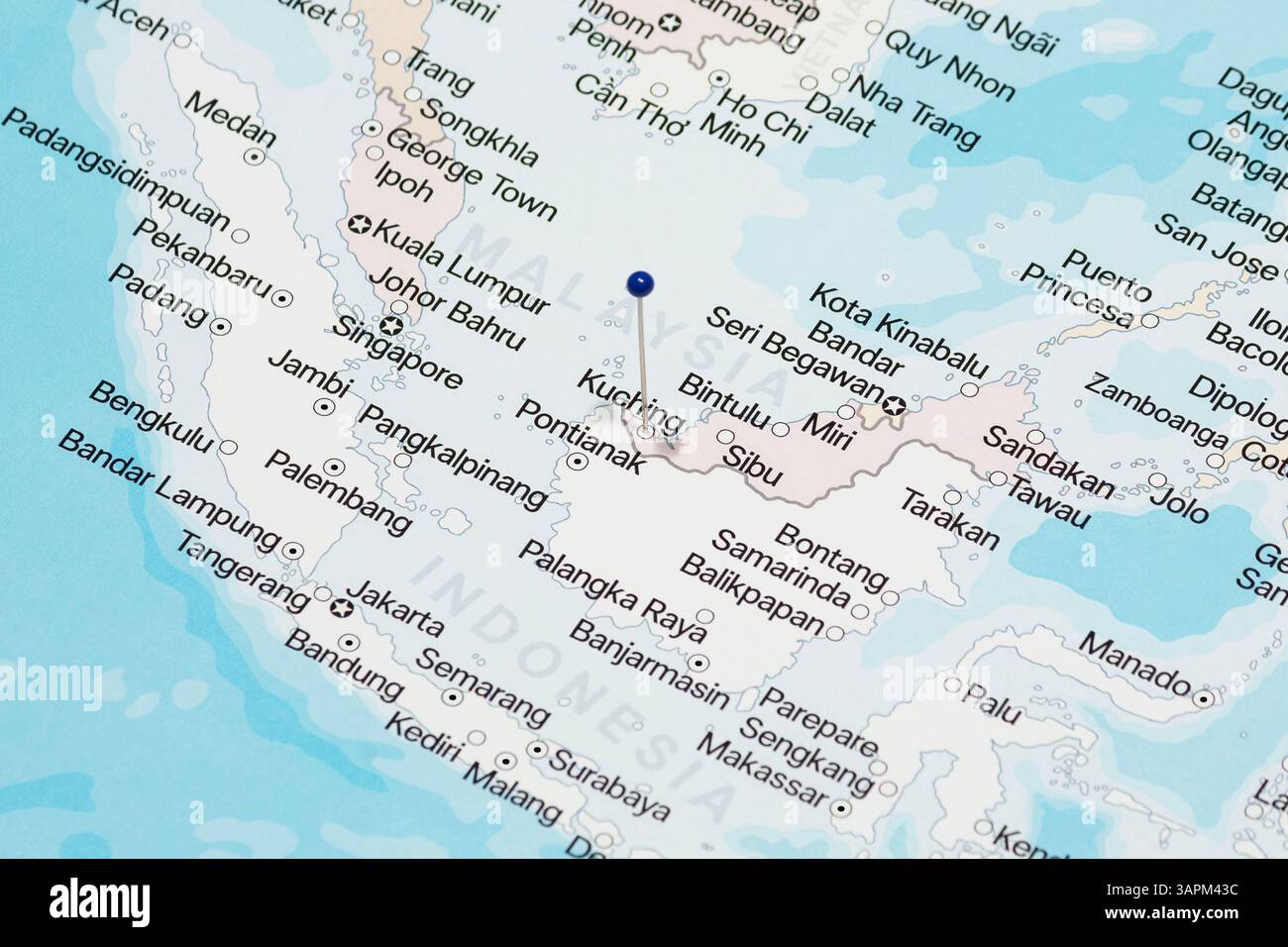 macro photo of a blue pin needle into kuching city of malaysia ...