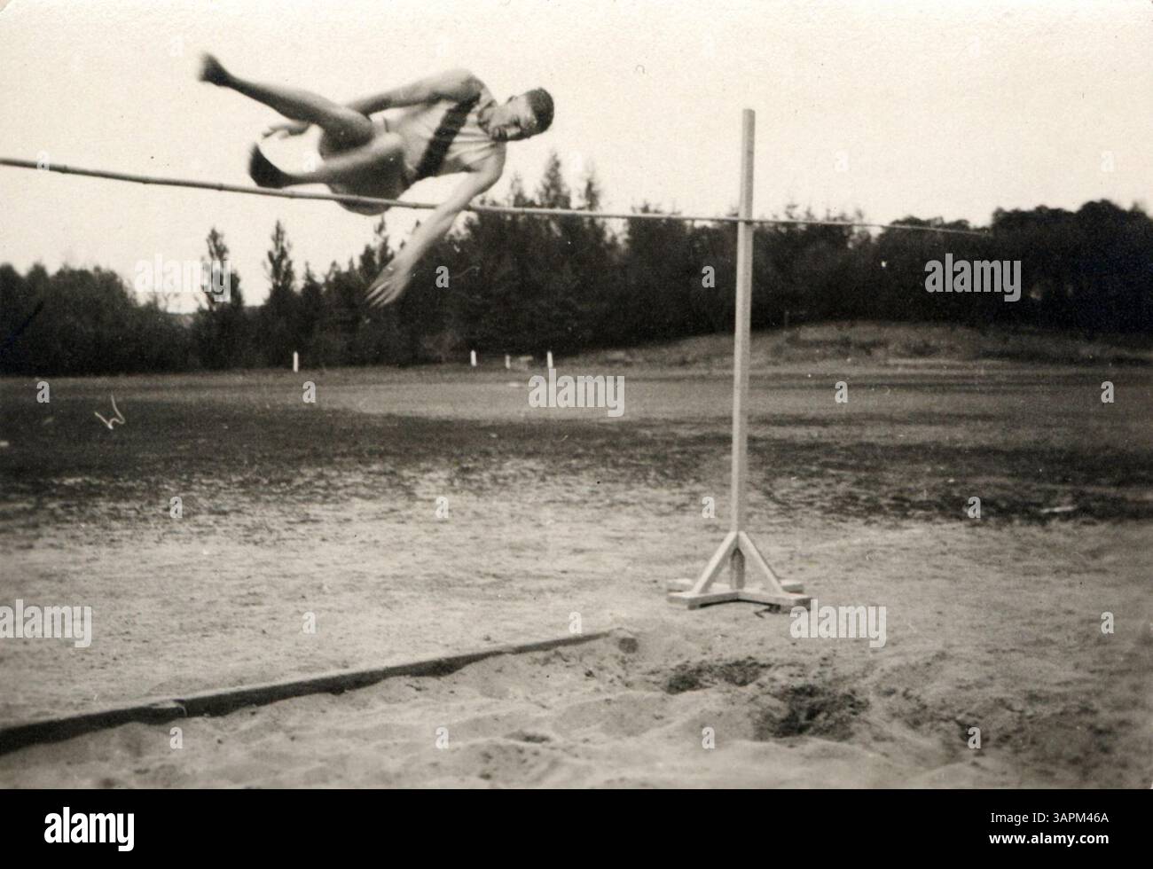 A black and white photograph of University of Oregon high jumper Chet ...