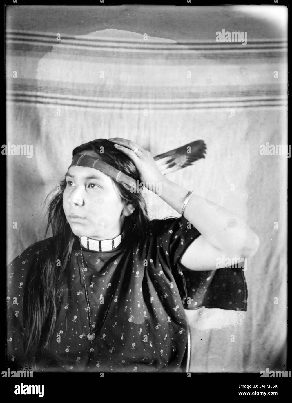 This photograph shows Tirzah Trask, an Umpqua woman, in regalia, likely taken in the Moorhouse ...