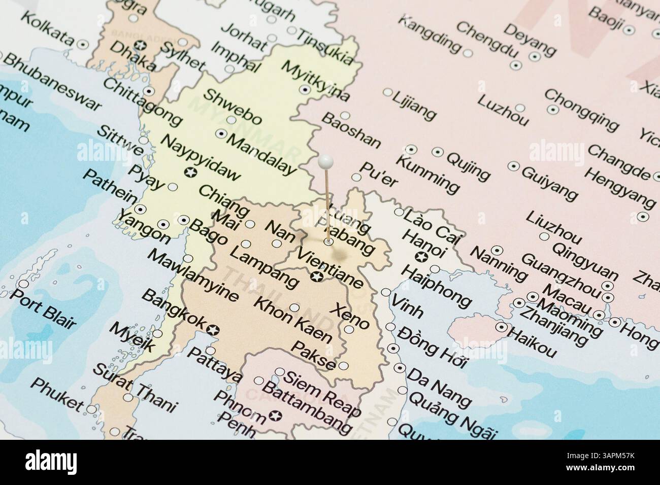 macro photo of a white pin needle into luang prabang city of laos ...