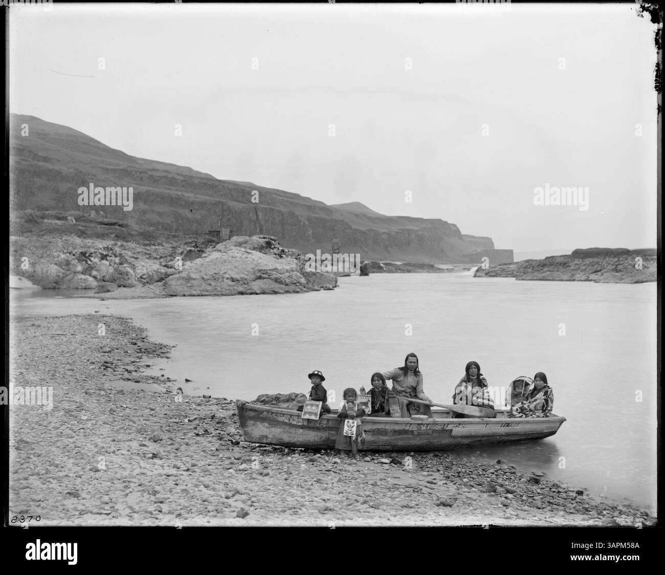 This photograph by Lee Moorhouse shows a tribal family in a rowboat on ...