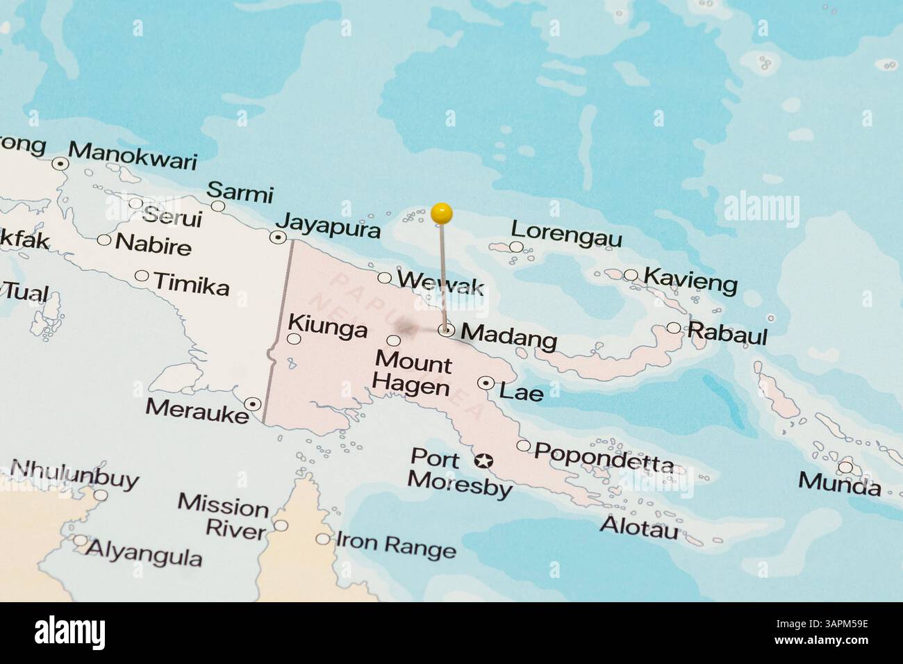 macro photo of a yellow pin needle into madang city of papua new guinea ...