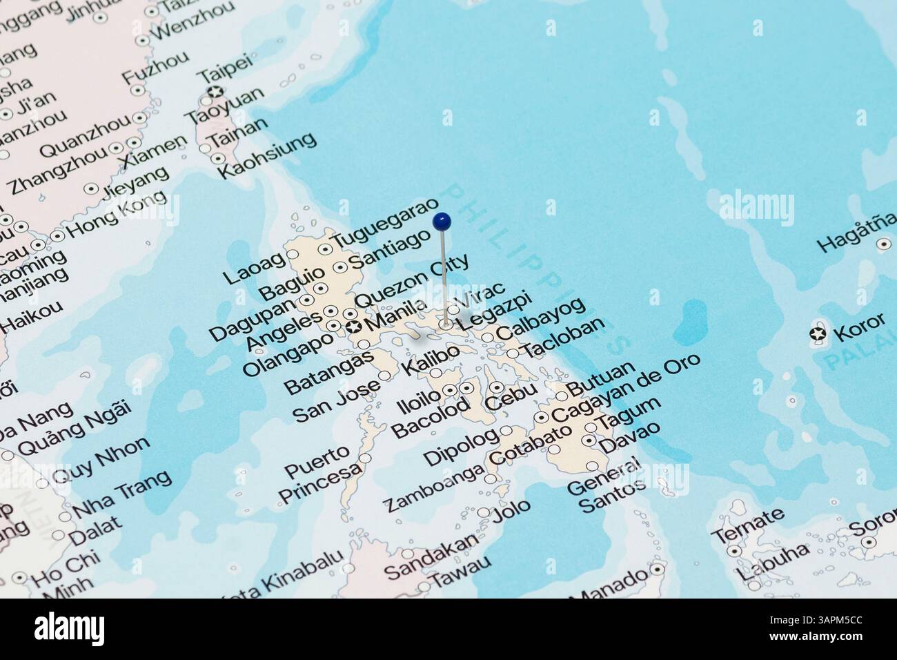 macro photo of a blue pin needle into legazpi city of Philippines ...