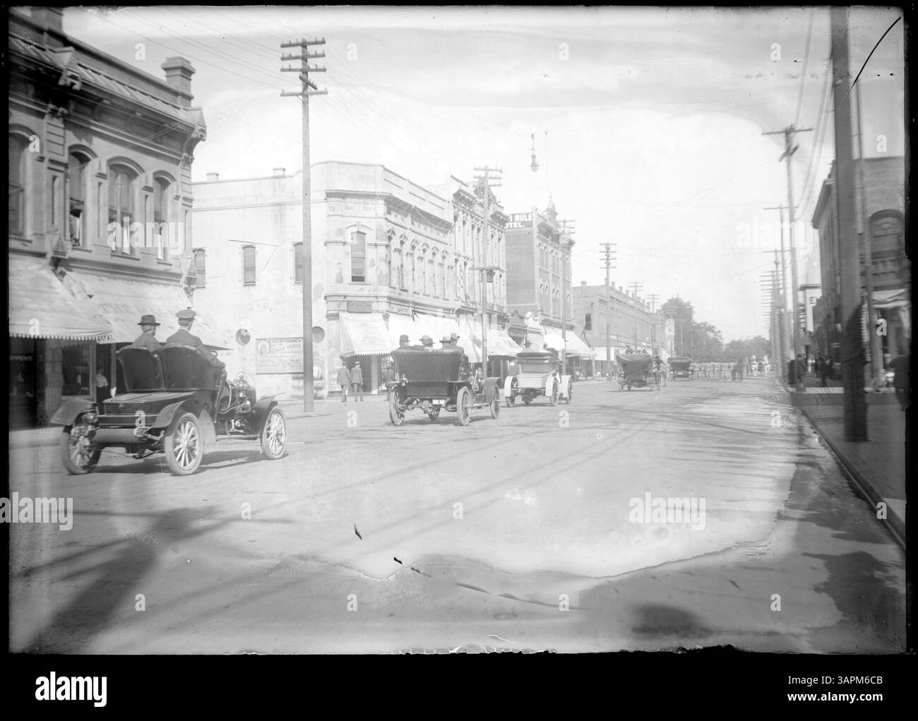 The photograph shows an automobile parade in Pendleton, Oregon, taken ...