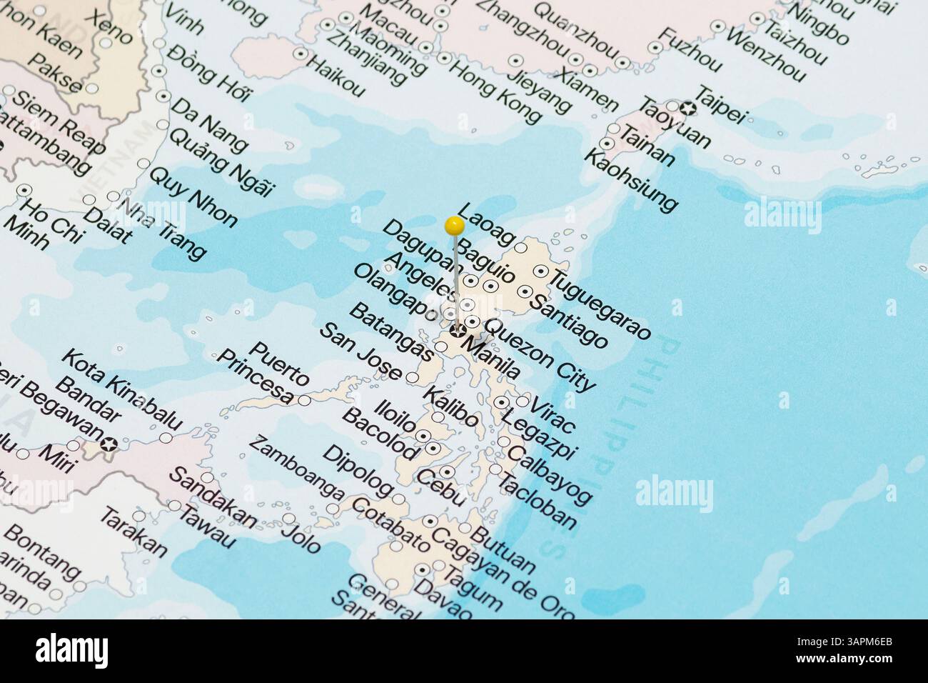 macro photo of a yellow pin needle into manila city of Philippines ...