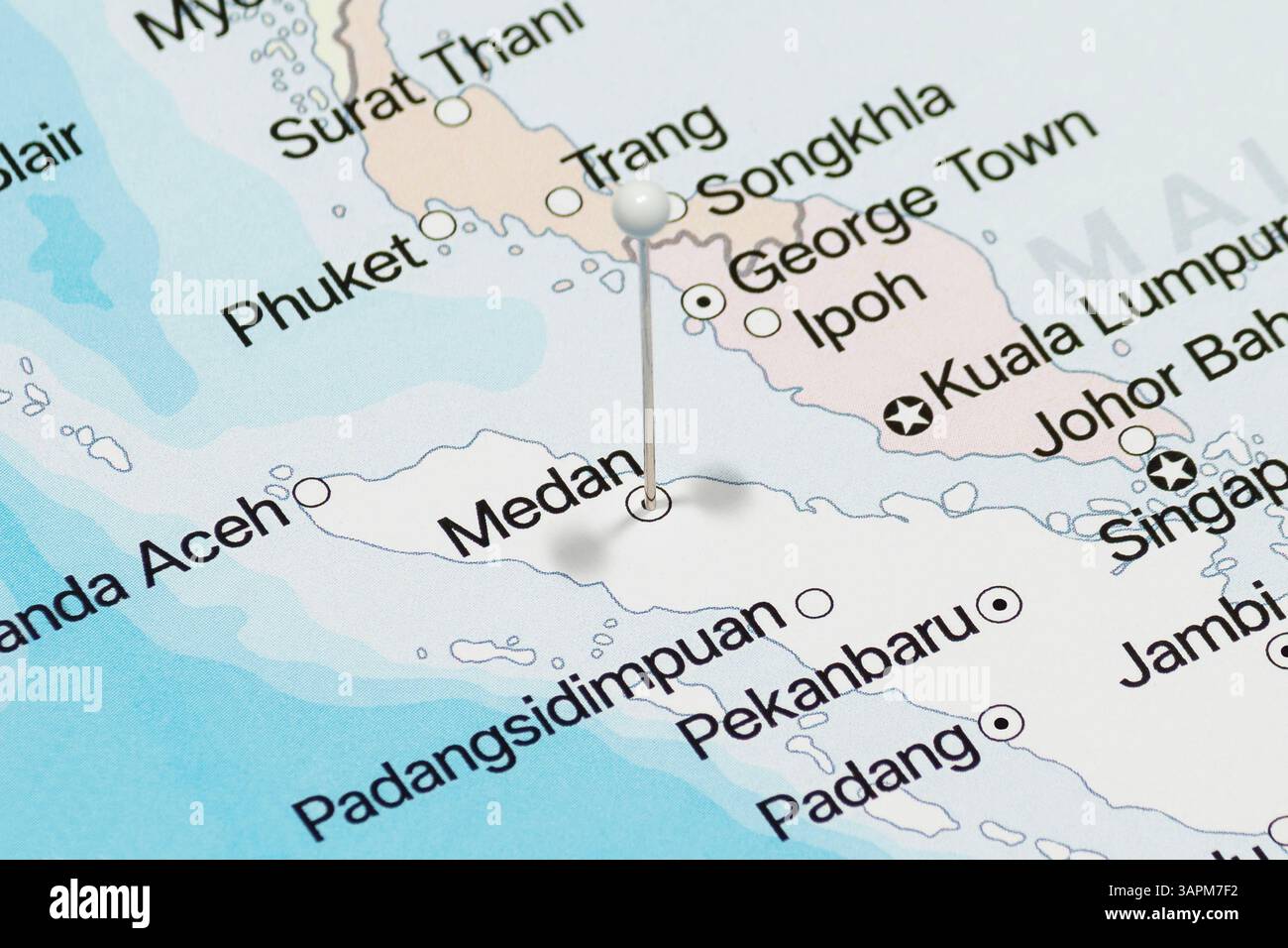 macro photo of a white pin needle into medan city of Indonesia ...