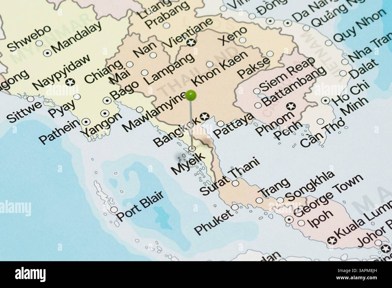 macro photo of a green pin needle into Myeik city of Myanmar political ...