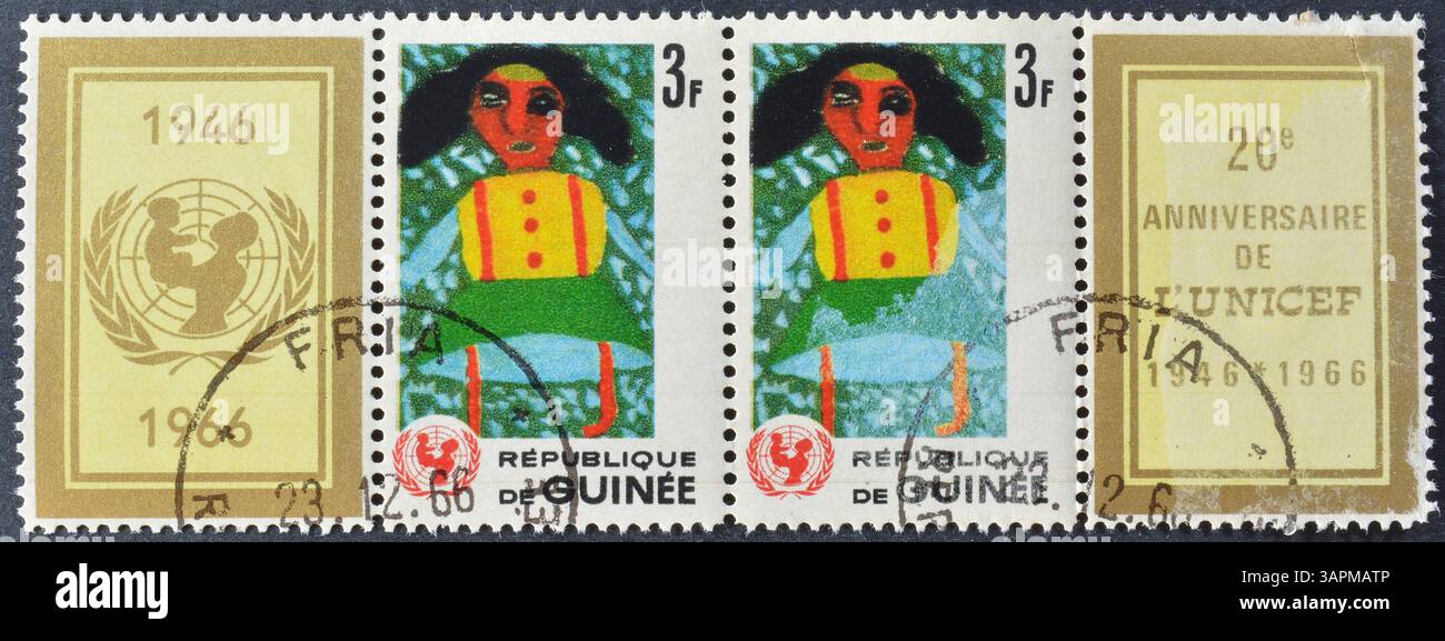 Cancelled postage stamp printed by Republic Guinea, that shows Children ...