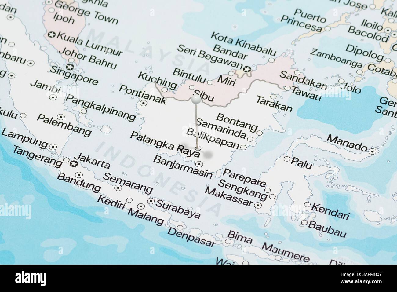 macro photo of a white pin needle into Palangka Raya city of Indonesia ...