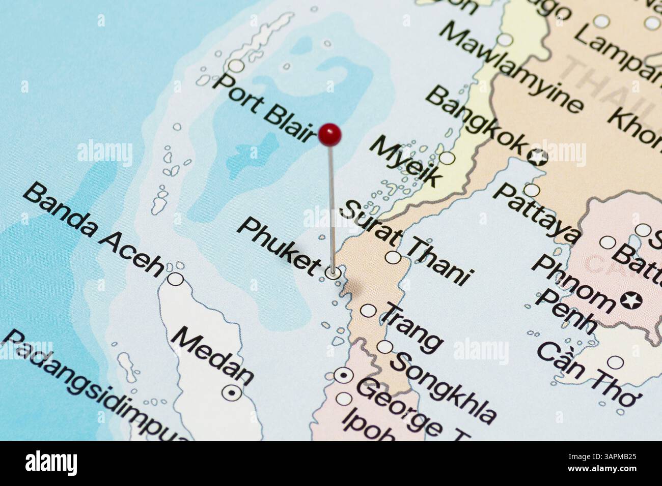 macro photo of a red pin needle into Phuket city of Thailand political ...