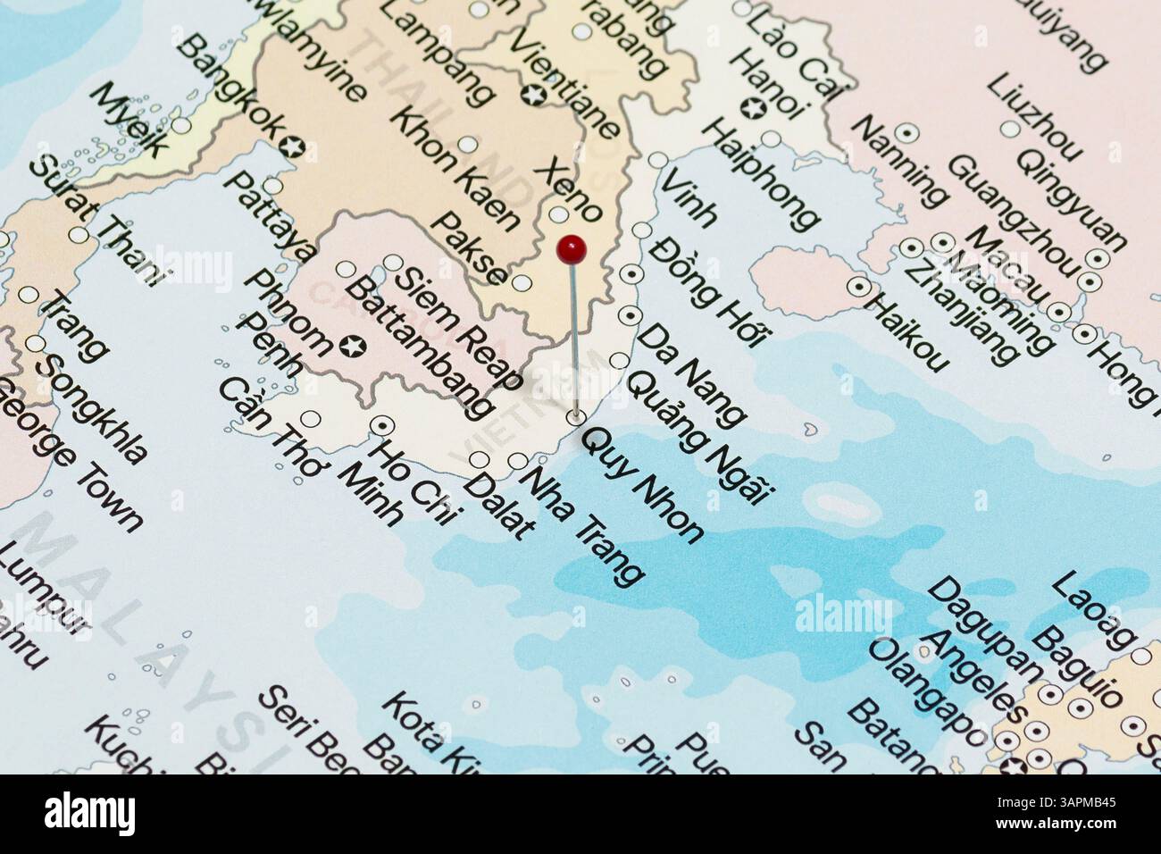 macro photo of a red pin needle into Quy Nhon city of Vietnam political ...