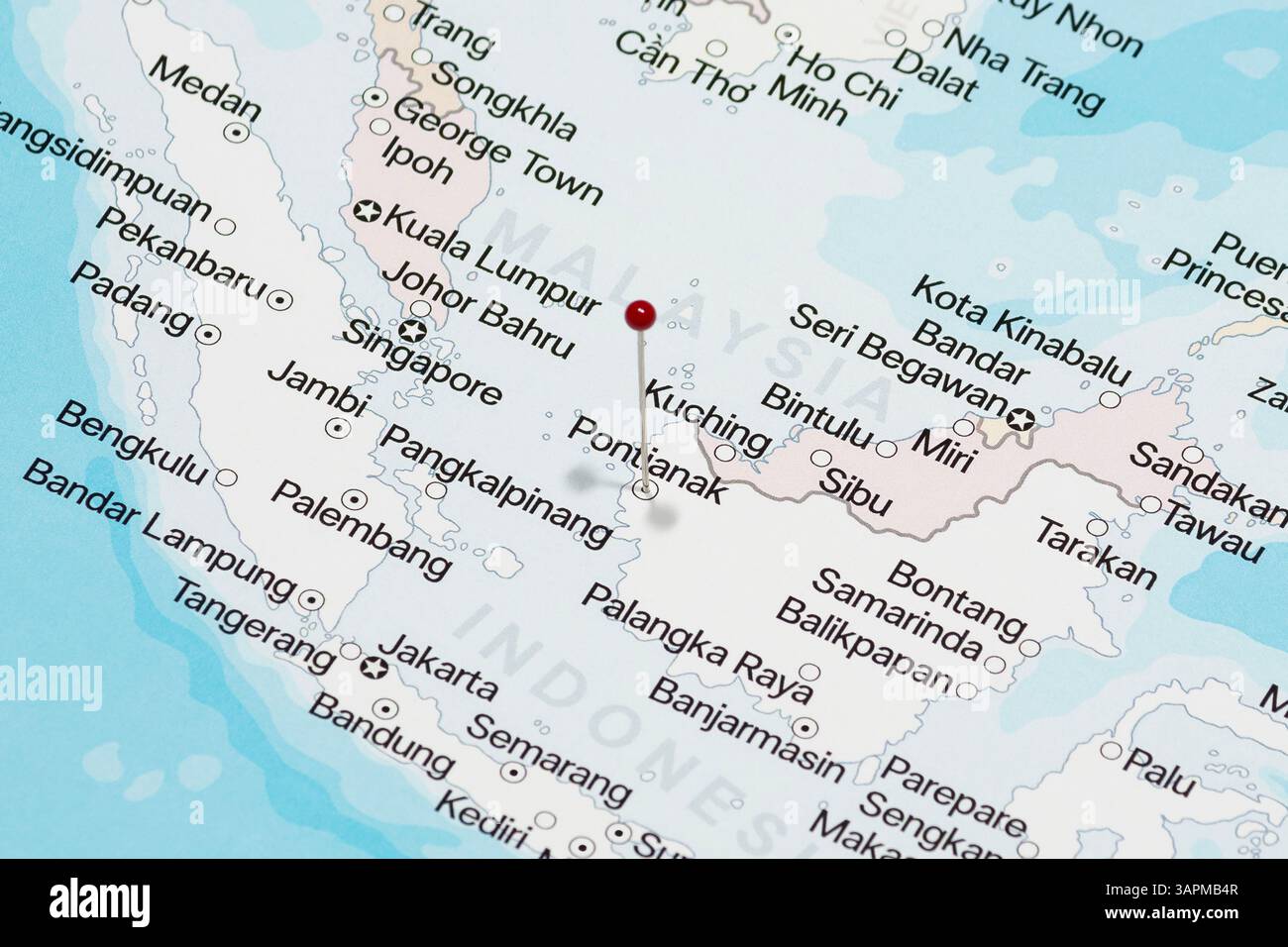 macro photo of a red pin needle into Pontianak city of Indonesia ...