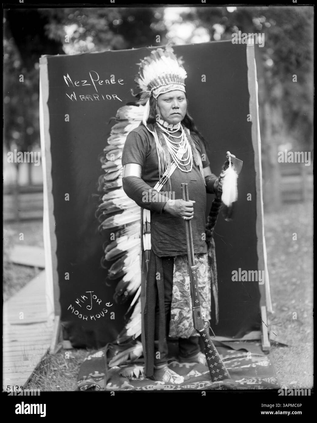 A series of poses of a Nez Perce Indian wearing a war bonnet ...