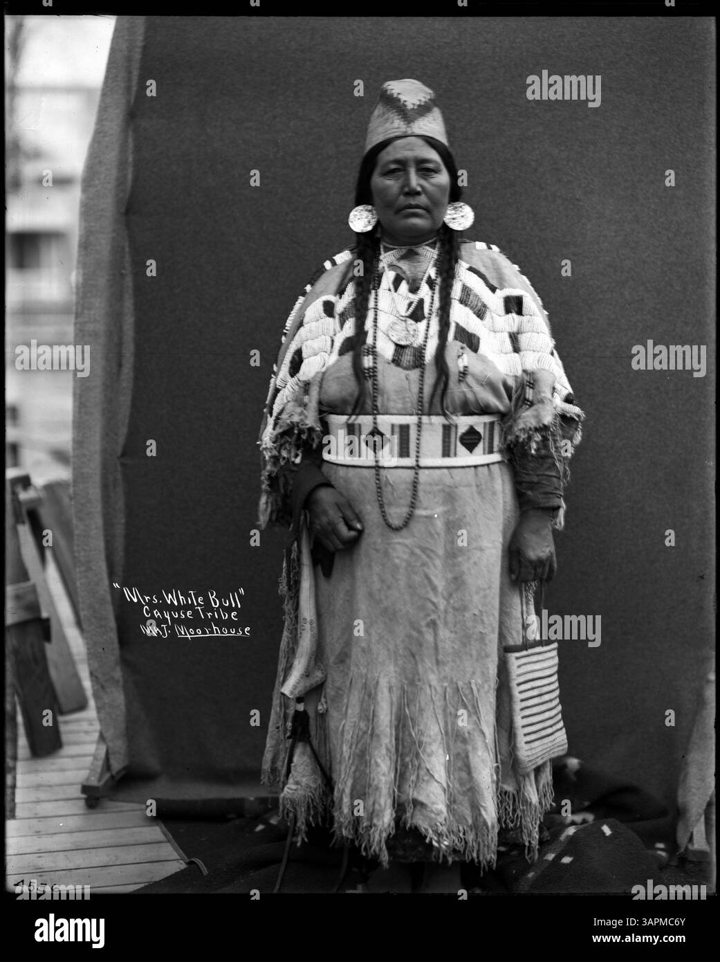 Photograph of Mrs. White Bull, a Cayuse woman, in full costume, part of ...