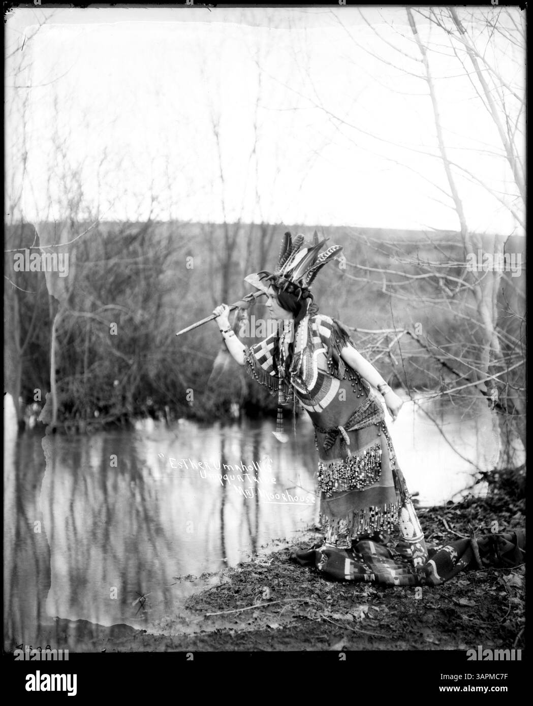 A photograph of Esther Umahollis, an Umpqua tribal woman, in regalia ...