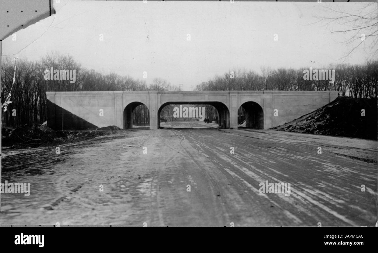 This historical image shows the partially completed Ford Bridge ...