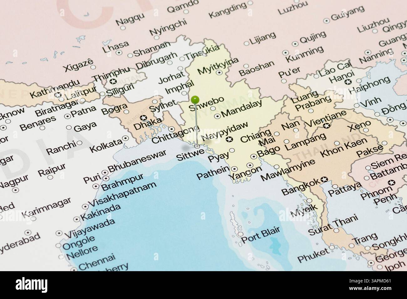macro photo of a green pin needle into Sittwe city of Myanmar political ...