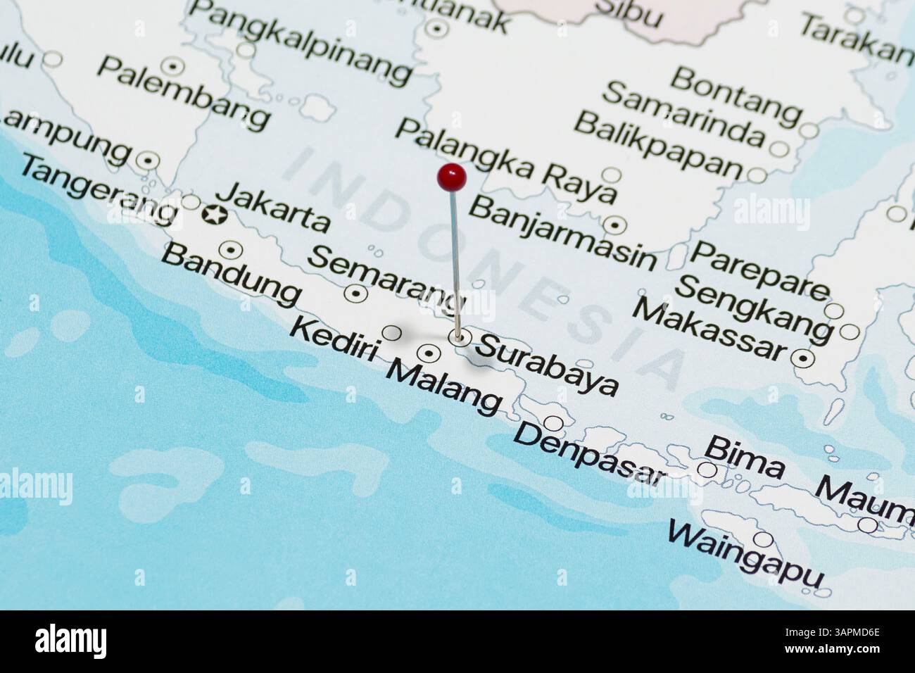 macro photo of a red pin needle into Surabaya city of Indonesia ...